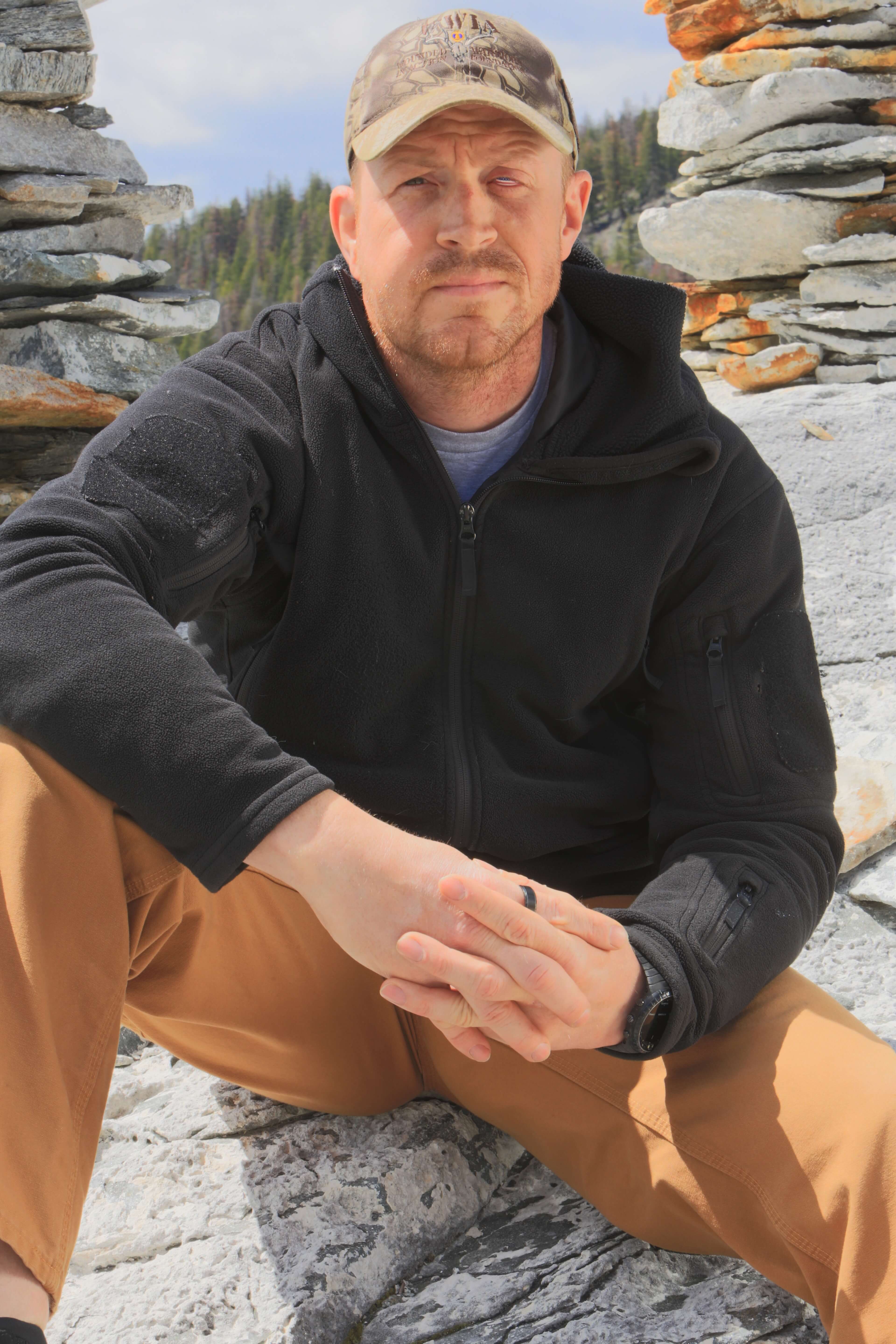 Wounded Warriors in Action Foundation A man sitting on rocks. - Wounded ...